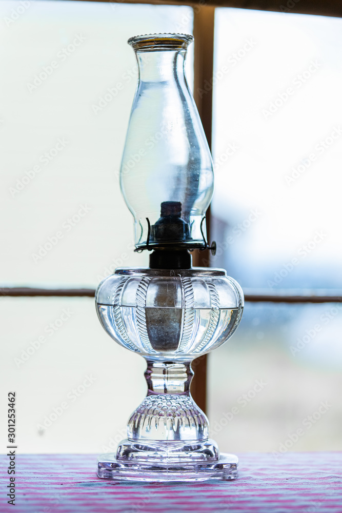 Old fashioned vintage kerosene oil lantern lamp burning with a soft ...