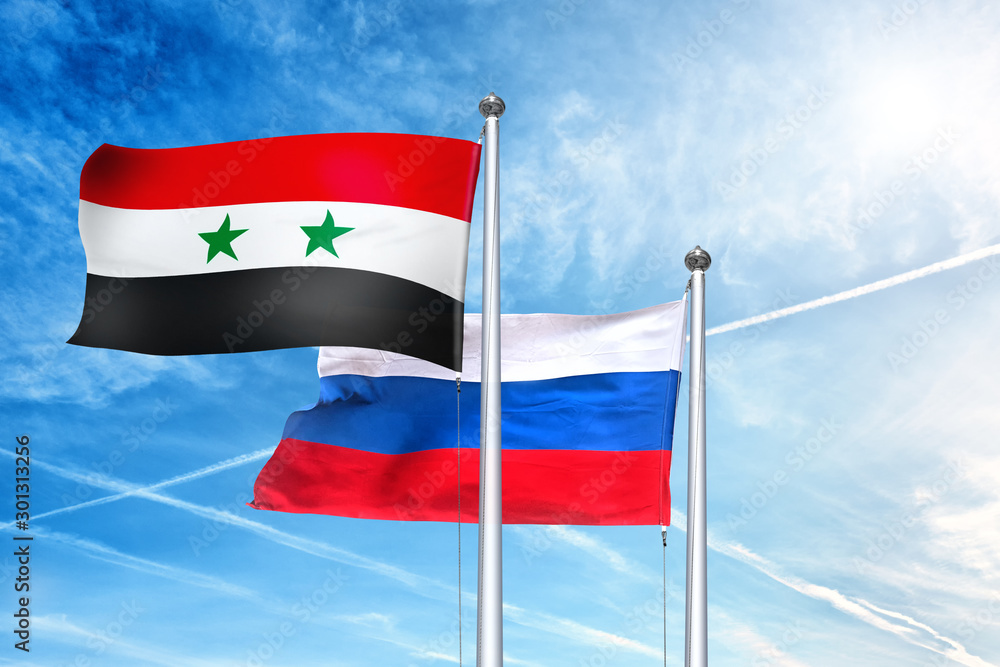 Syria and Russia national flag waving against clouds blue sky. Side ...