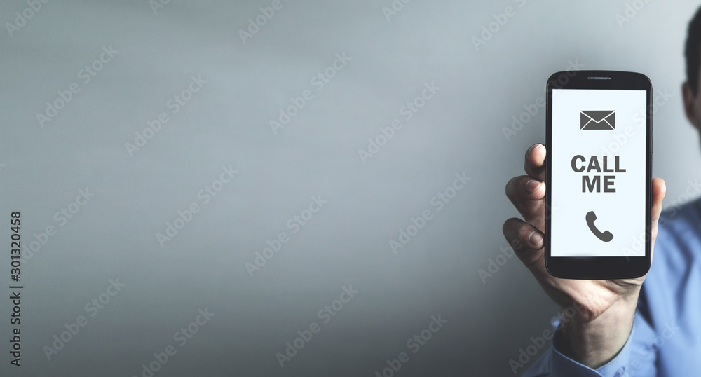 Man holding smartphone. Call Me Stock Photo | Adobe Stock