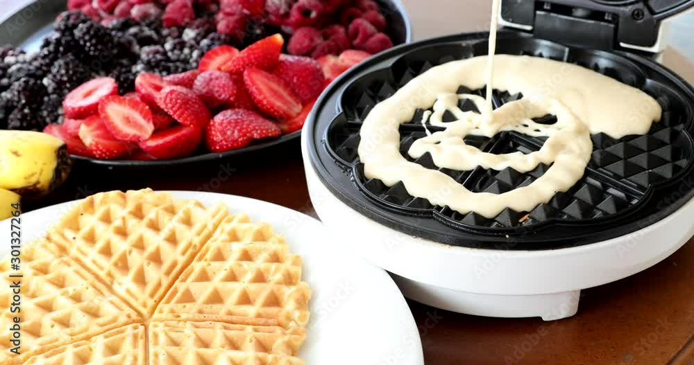 Making Homemade Delicious Waffles In An Electric Waffle Maker Stock ...