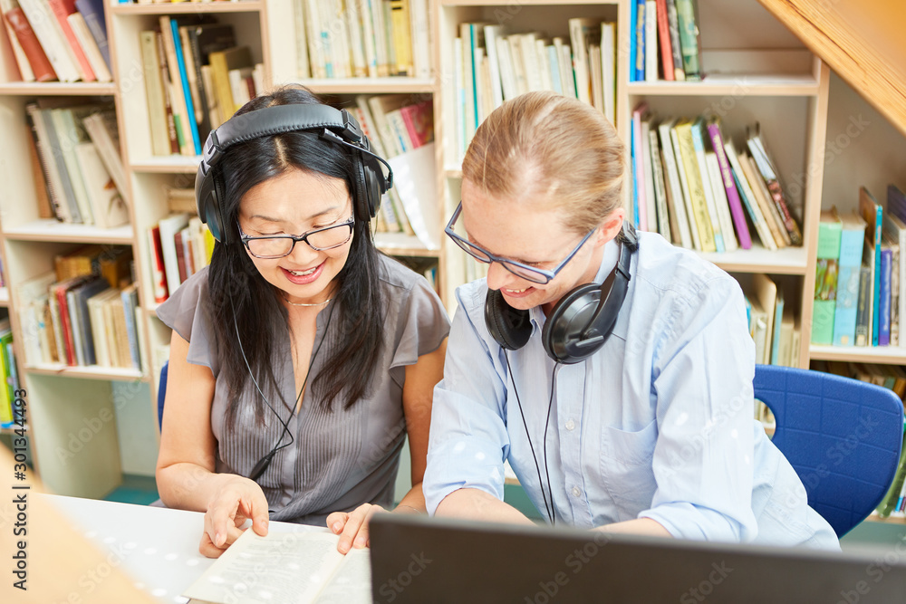 Two women are learning together in library Stock Photo | Adobe Stock