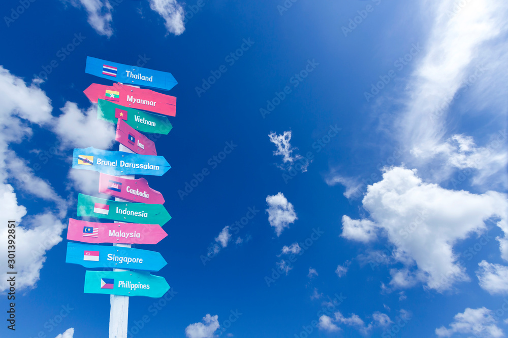 AEC country name on multicolor wood signboard over blue sky Stock Photo ...