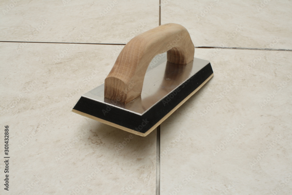 Grouting tile process Stock Photo | Adobe Stock