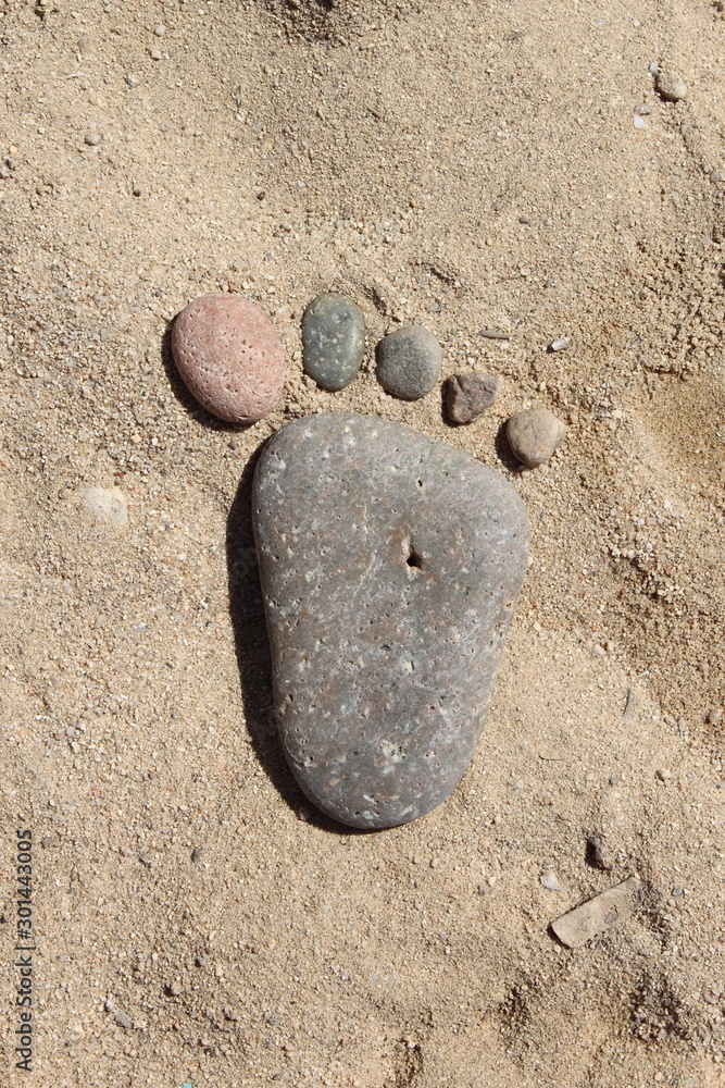 Foot designed with stones Stock Photo | Adobe Stock