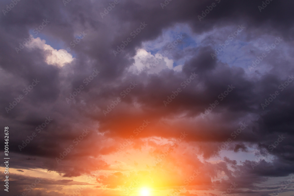 Epic dramatic sunset, sunrise on storm sky with dark clouds, orange ...