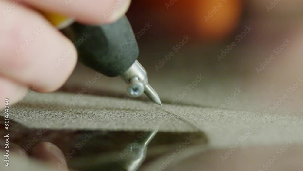 Vidéo Stock Closeup view of worker's hand is carefully sandblasting ...