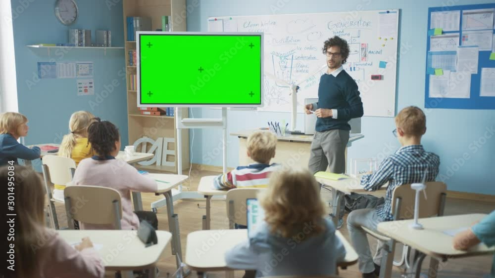 In the Elementary School Classroom: Teacher Uses Horizontal Green Mock ...