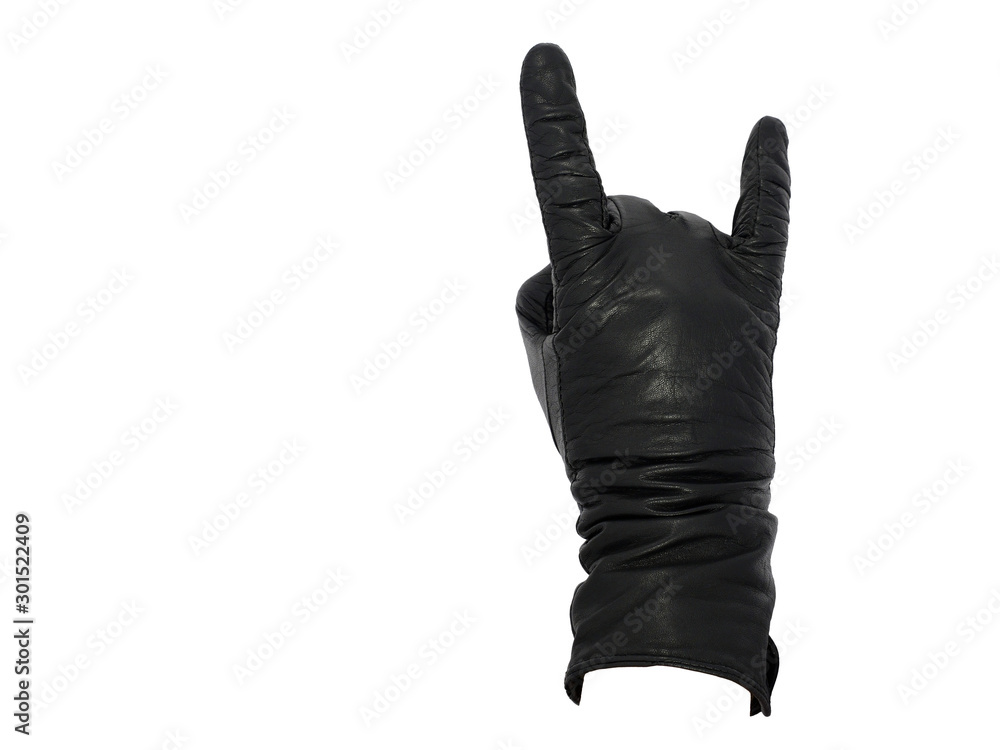 Hand in slightly worn black leather glove shows goat sign, devil horns ...