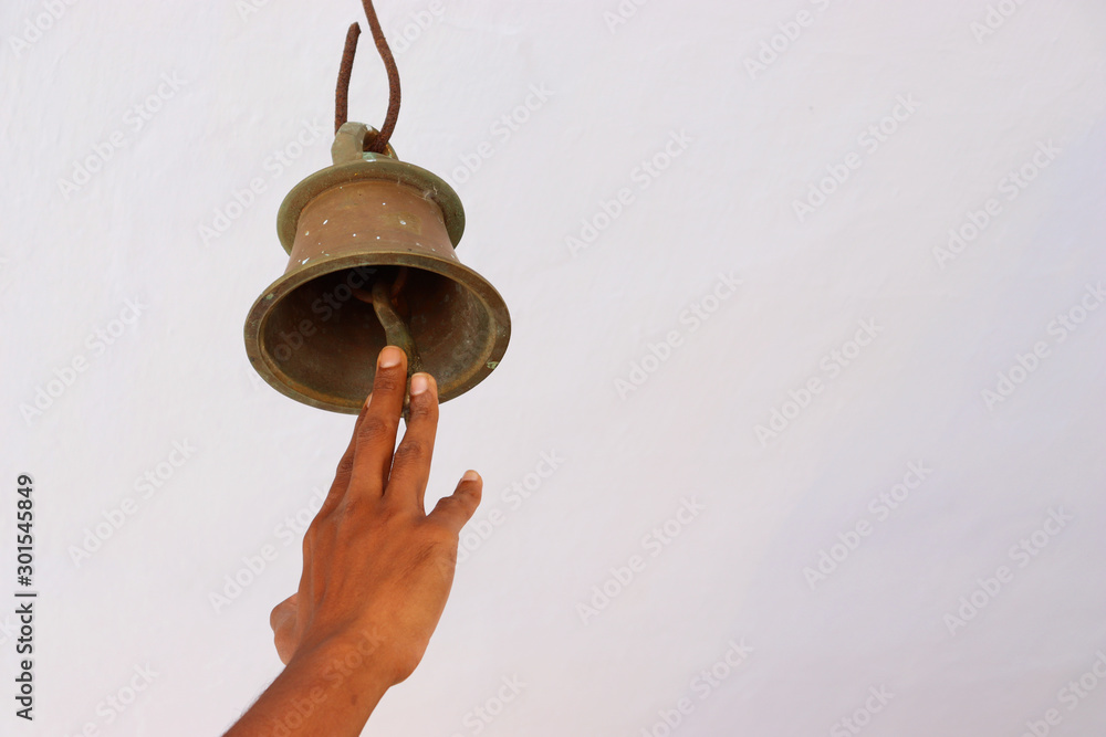 hand holding a bell on white background Stock Photo | Adobe Stock