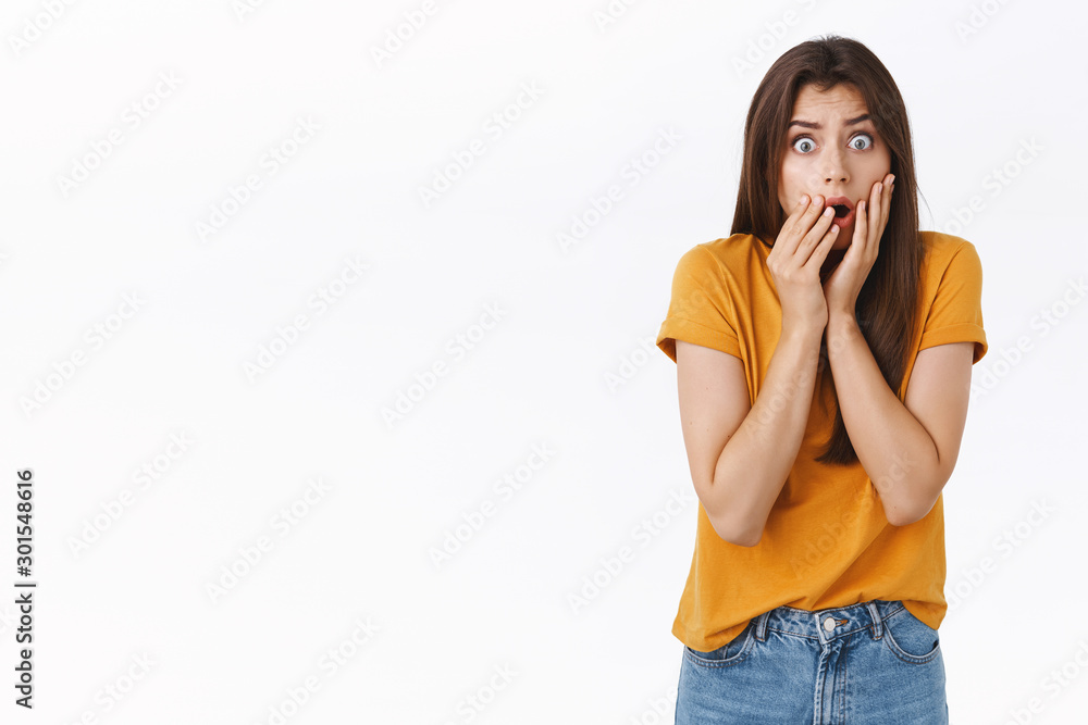 Scared, shocked timid insecure woman standing speechless, drop jaw ...