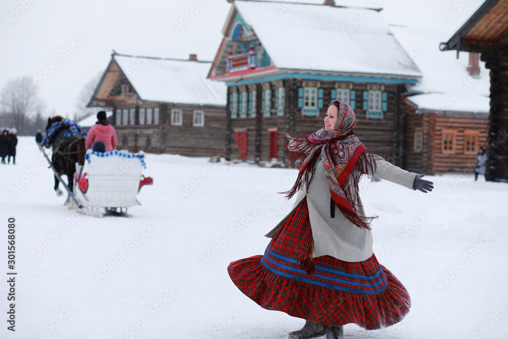 young girls in traditional costumes of the Russian north in winter ...