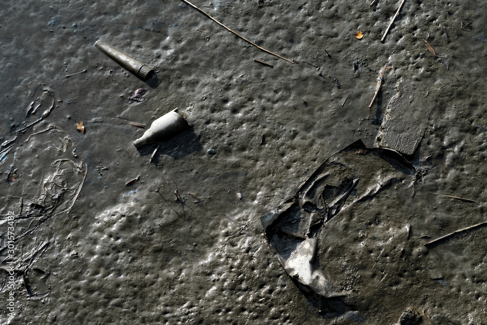 Trash and garbage in the sludge during the emptying of the canal ...