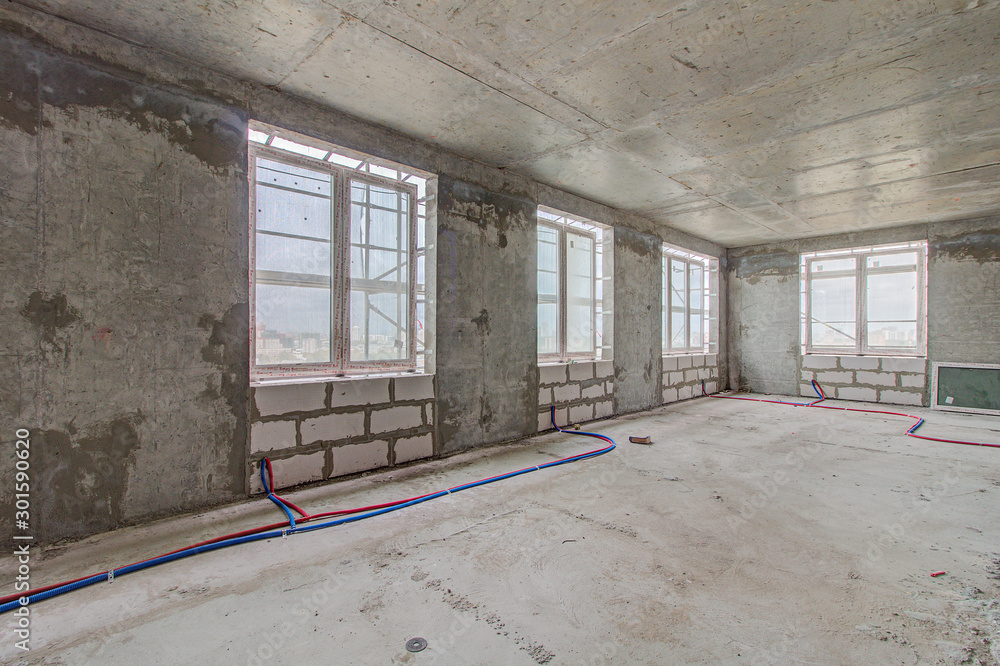 Premises before leveling, finishing, painting, plastering. Empty room ...