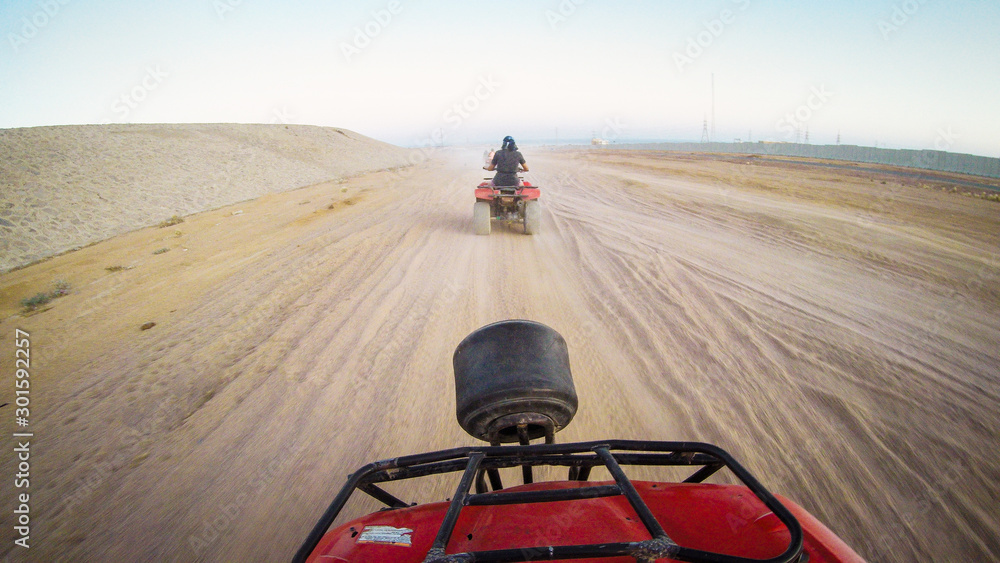 Girls drive quad biike.Desert in Egypt. Sharm el Sheikh. Sand and Sand ...