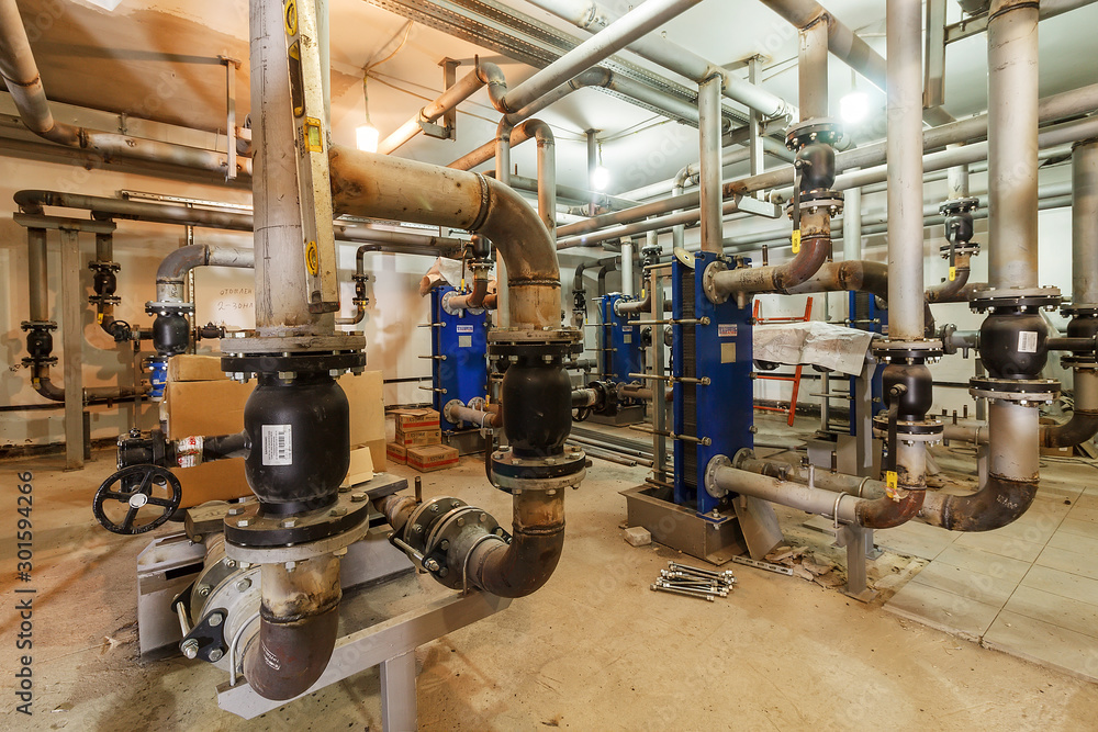 pumping station under construction. pipes of central heating system and ...