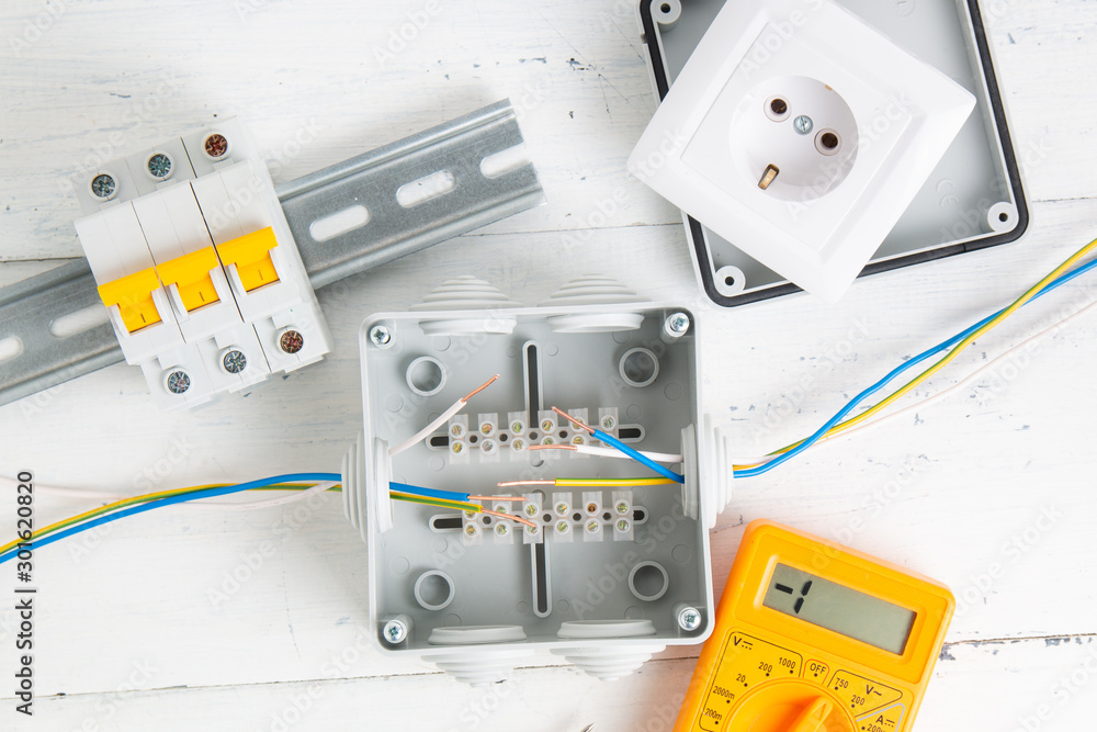 electrical outlet, switch, cutting box and digital multimeter ...