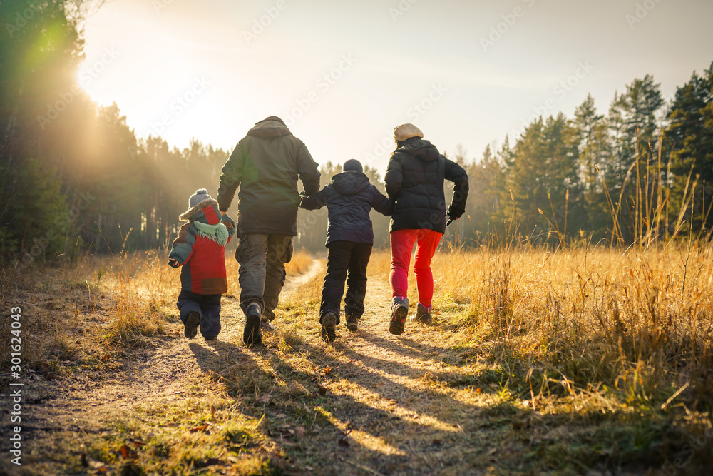 happy family running on country road Stock Photo | Adobe Stock