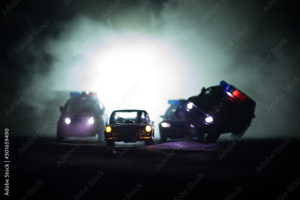Toy BMW Police and Toyota FJ Cruiser cars chasing a Ford Thunderbird ...