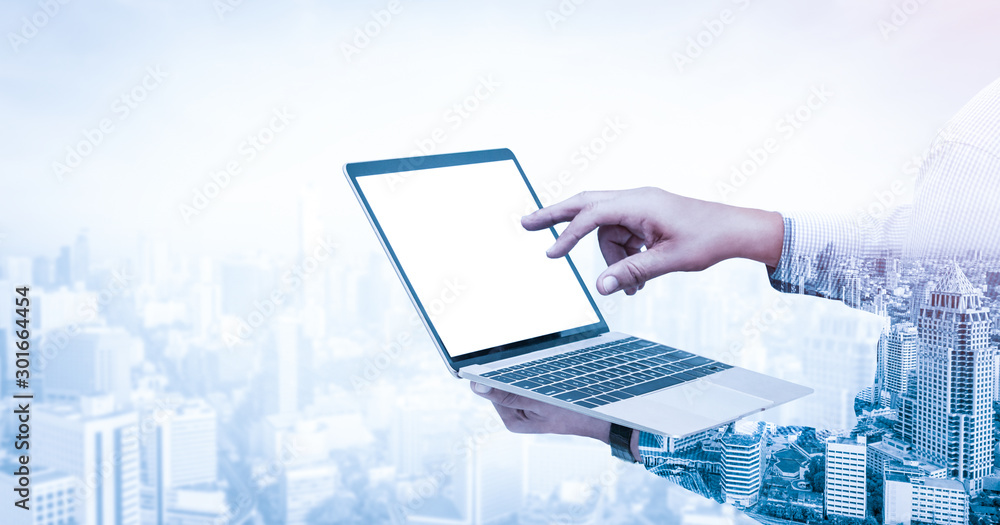 Double exposure image of businessman using computer on abstract modern ...