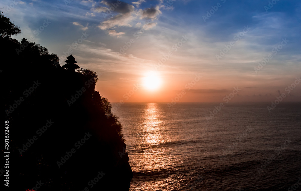 Sunset at the Ulu Watu temple on Bali, Indonesia Stock Photo | Adobe Stock