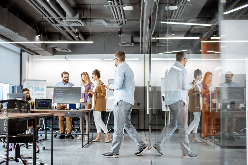 Interior view on the modern office room with diverse people working on ...