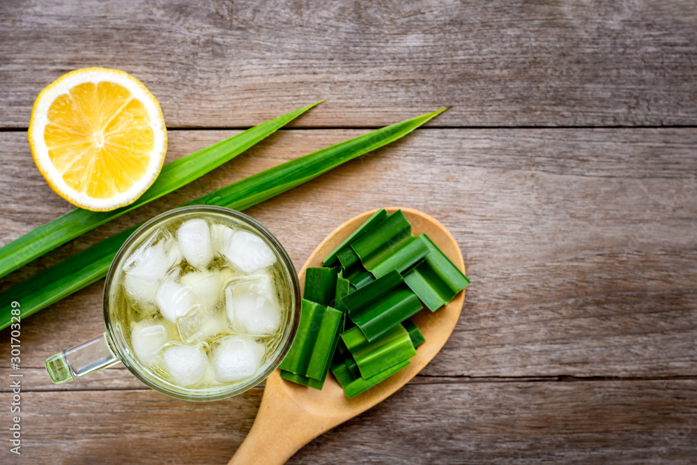 Glass of water pandan juice with green pandan leaf sliced and yellow ...
