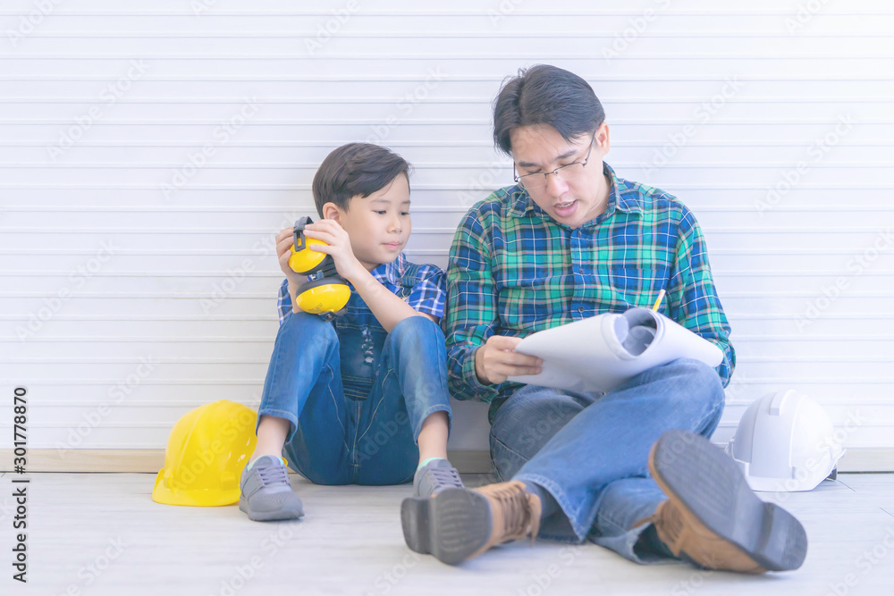 Like father like son concept with asian father and son working on ...