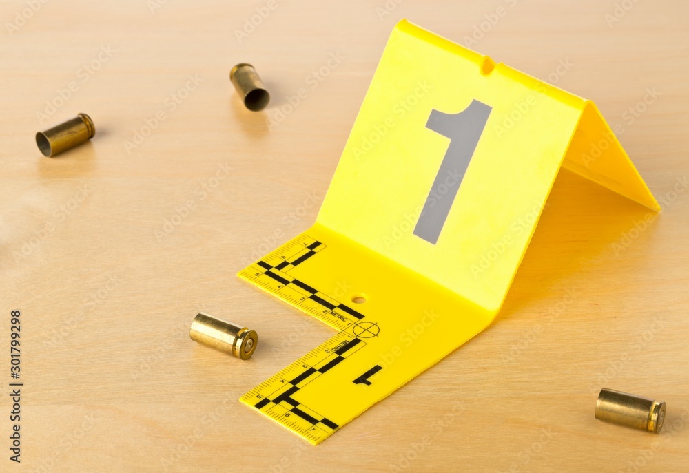 Crime scene investigation CSI evidence marker with empty, fired 9mm ...