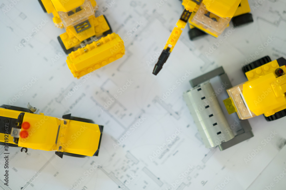 Car toys transport construction on architectural project, construction ...