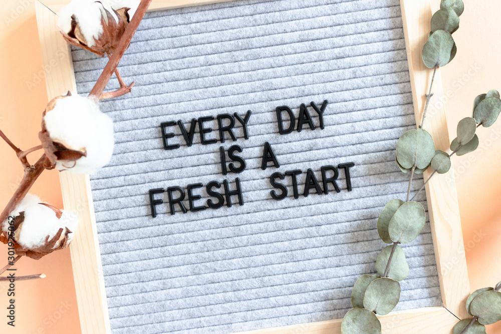 Flowers and letterboard with quote Every day is a fresh start Stock ...