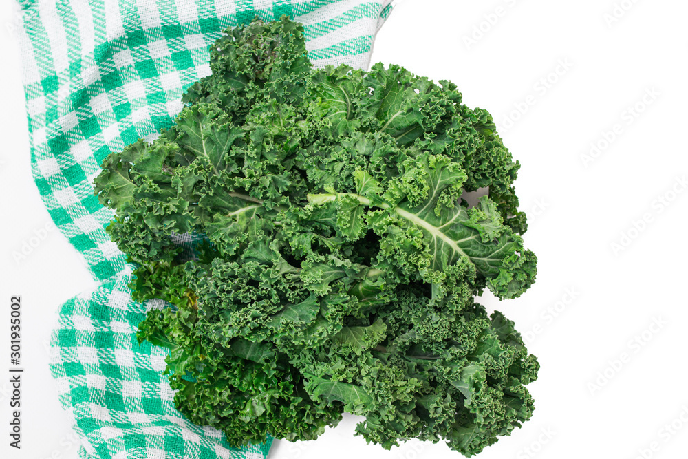 curly natural vegetable with dishcloth on white background Stock Photo ...