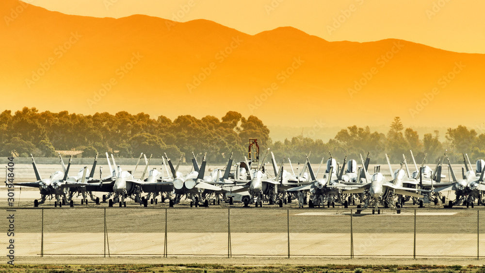 military fighter jet storage facility at airport against mountain ...