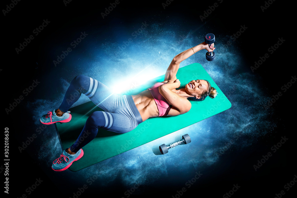 Sporty woman with beautiful beautiful body working out on black ...