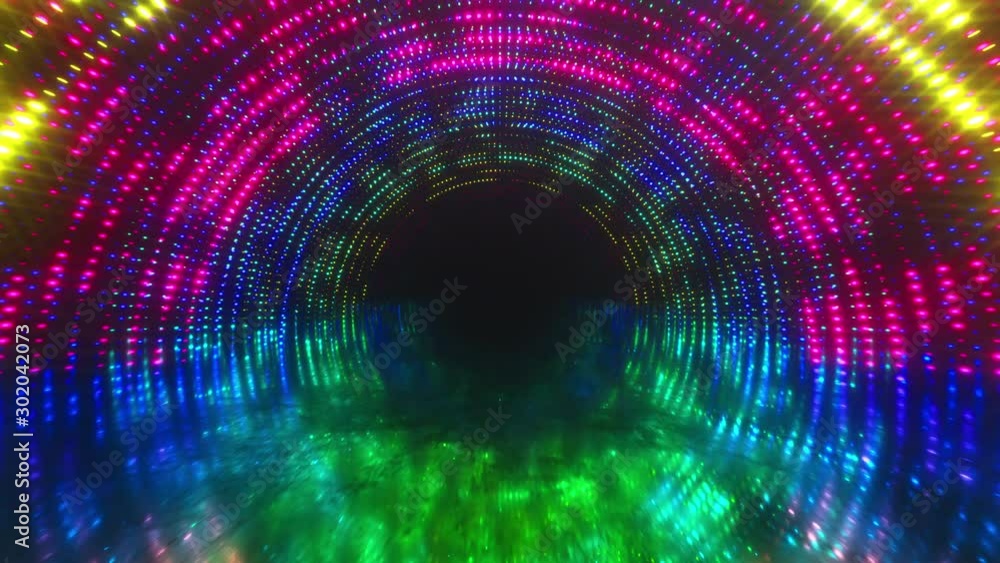 Bright light tunnel of luminous multi-colored dots and a reflective ...