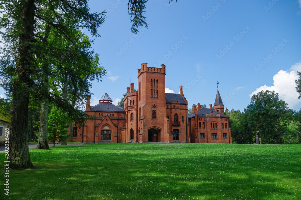 Old red brick manor house in the style of English castles. Sangaste ...
