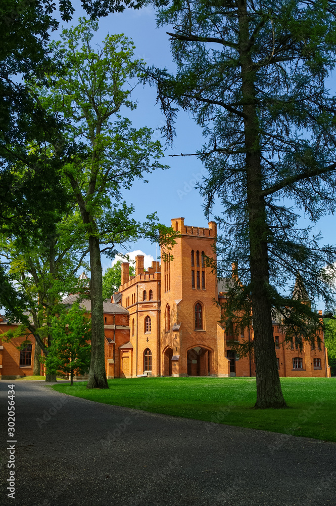 Old red brick manor house in the style of English castles. Sangaste ...