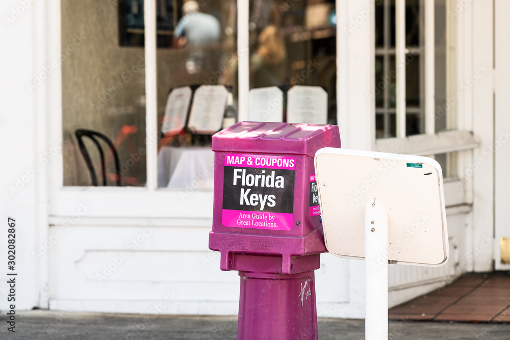 Key West, USA - May 1, 2018: Purple free newspaper, magazine stand ...