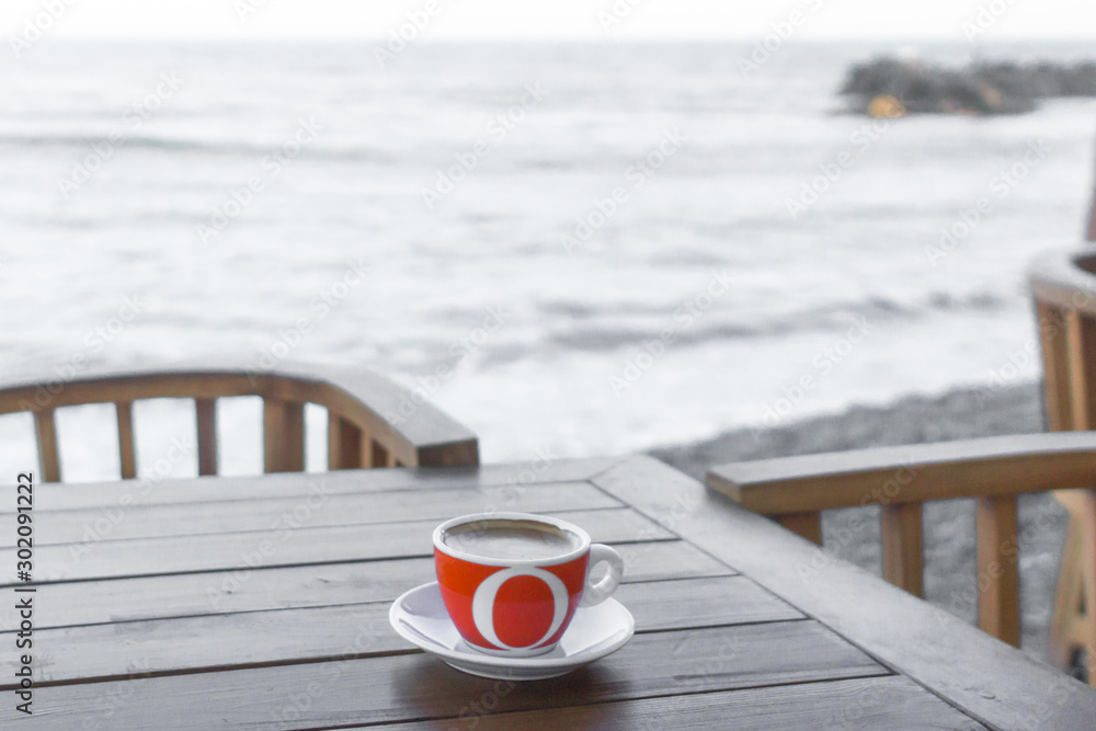 Drinking coffee by the sea. Street Cafe. Seaside restaurant. Cup of ...