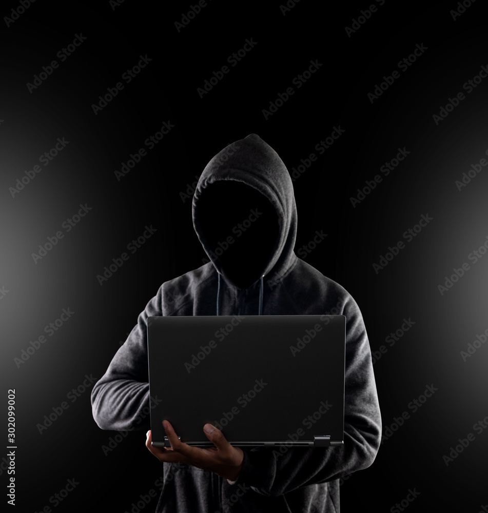 Cybercrime, hacking and technology crime. no face hacker with laptop on ...