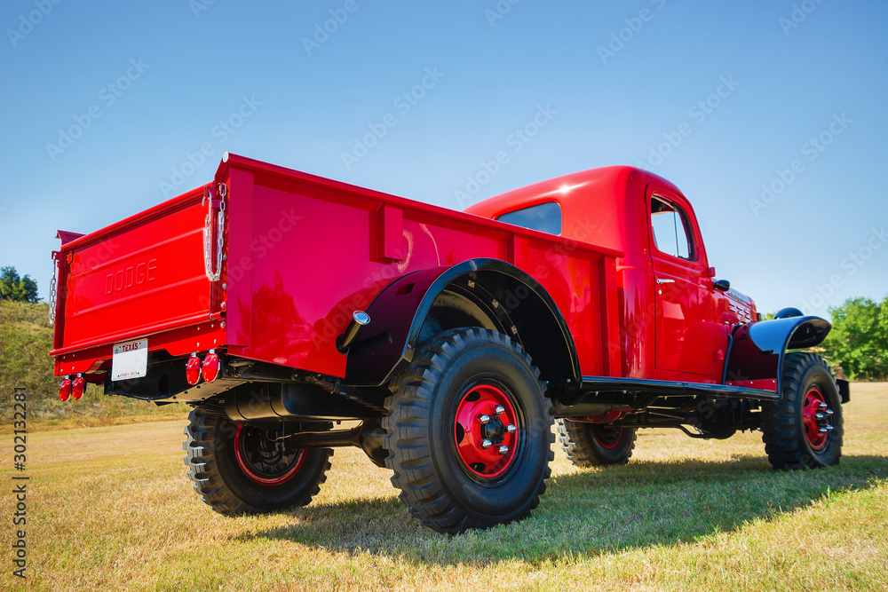 Back side view of a red vintage 1948 Dodge Power Wagon classic truck on ...