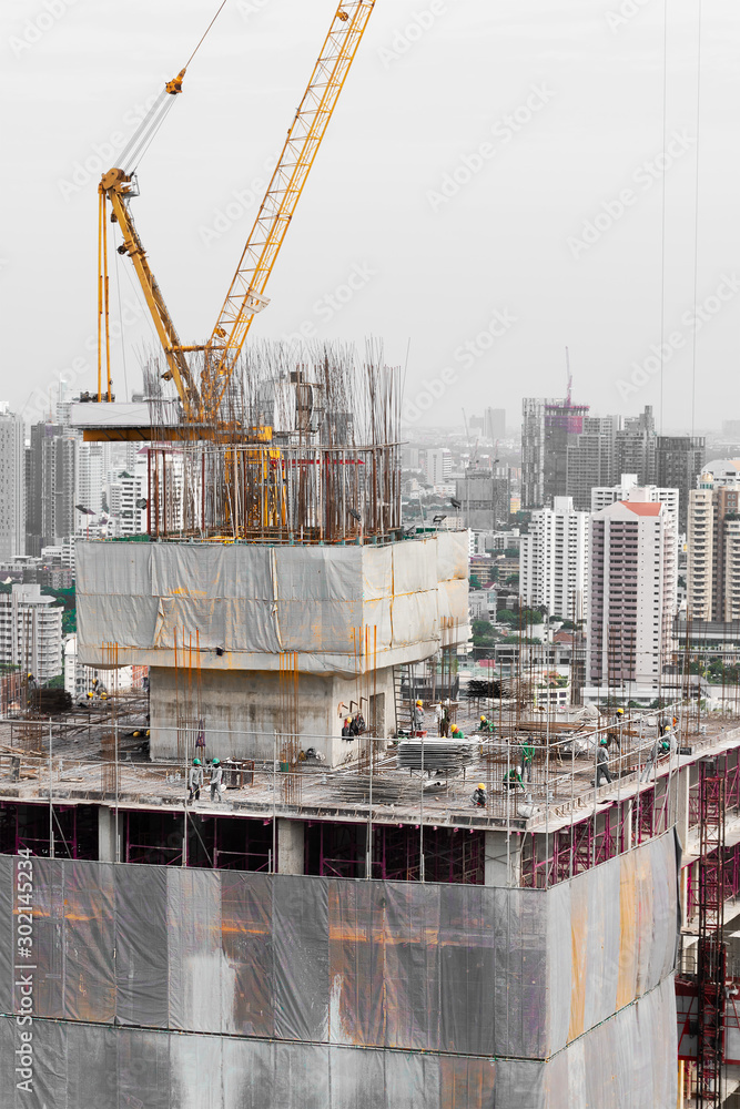 Aerial view of a building construction site in progress with tower ...