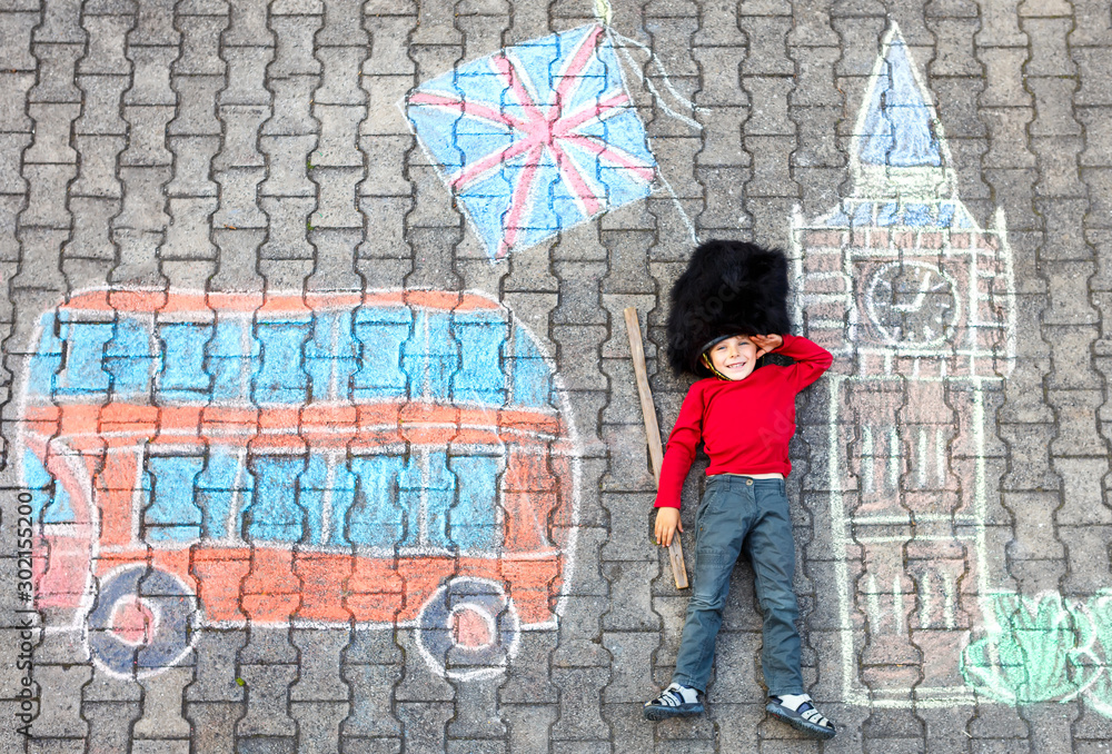 Happy little kid boy in british queen's guard soldier uniform having ...