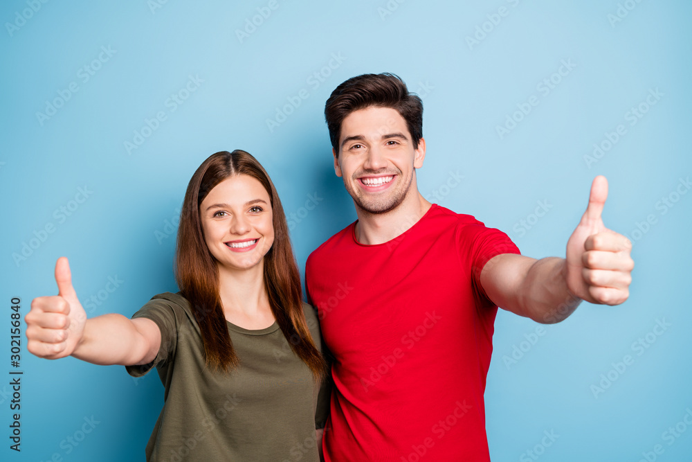 Portrait of positive two spouses promoter show thumb up recommend ads ...