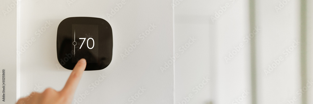 Thermostat smart home domotic control panel on wall for winter house ...