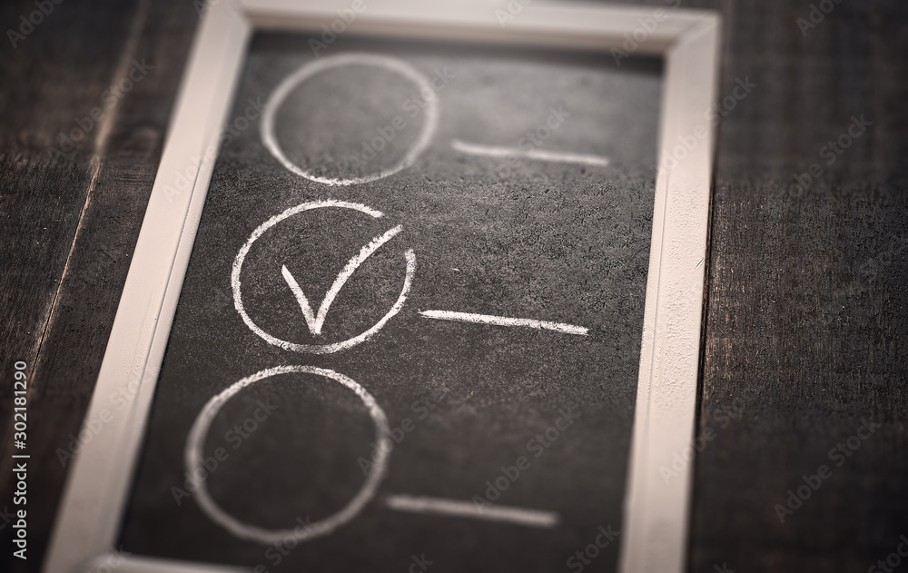 Blackboard with check boxes on chalk board. Hand writing. Dark ...