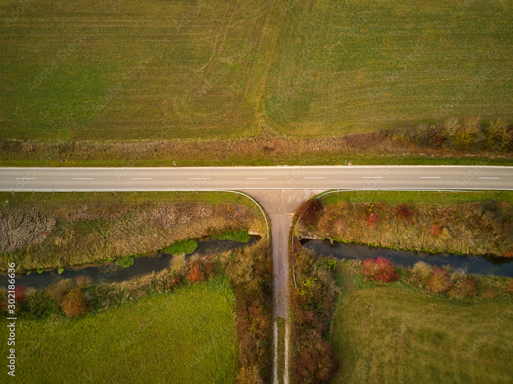 Road with T-junction and bridge from above Stock Photo | Adobe Stock