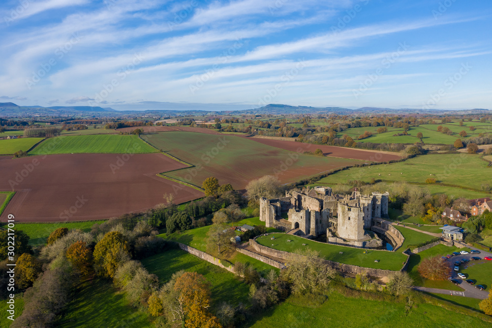 Aerial view of a large medieval castle showing the turrets, walls and ...