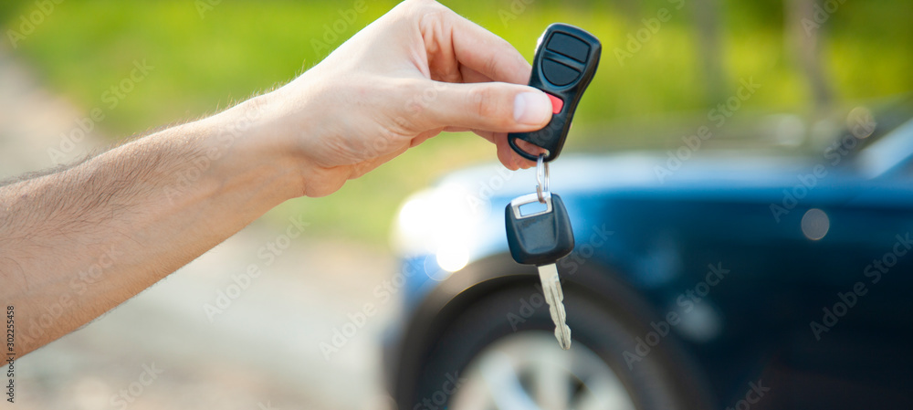 man hand key on car in nature Stock Photo | Adobe Stock