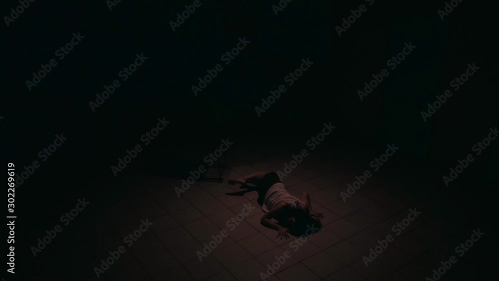 Depressed girl in a dark room. Lonely woman locked in room. The ...