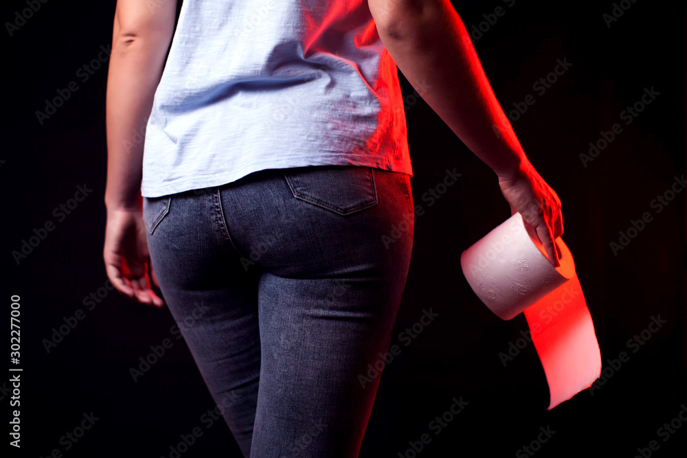 Woman with hemorrhoid or diarrhea with toilet paper in hand. People ...